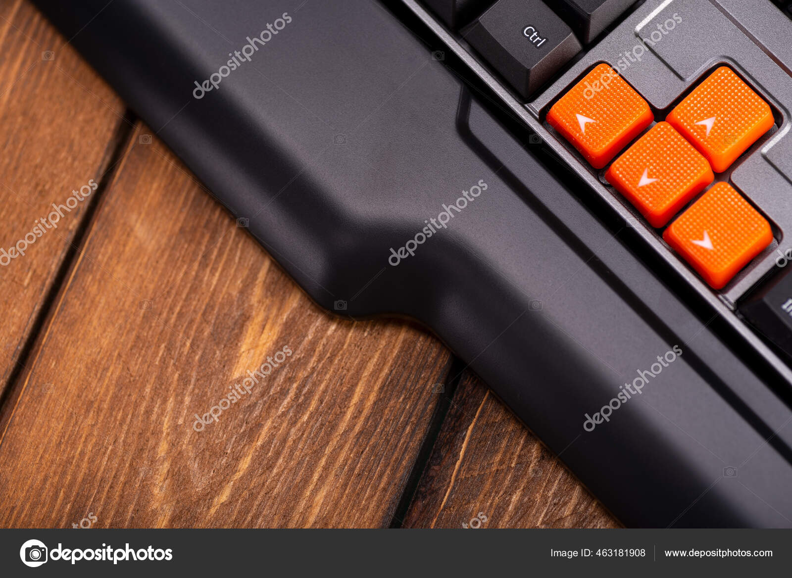 Orange arrow keys on a black keyboard, up, down, left, right buttons on ...