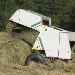 Tractor collecting haystack in the field — Stock Photo © rihardzz #6212366
