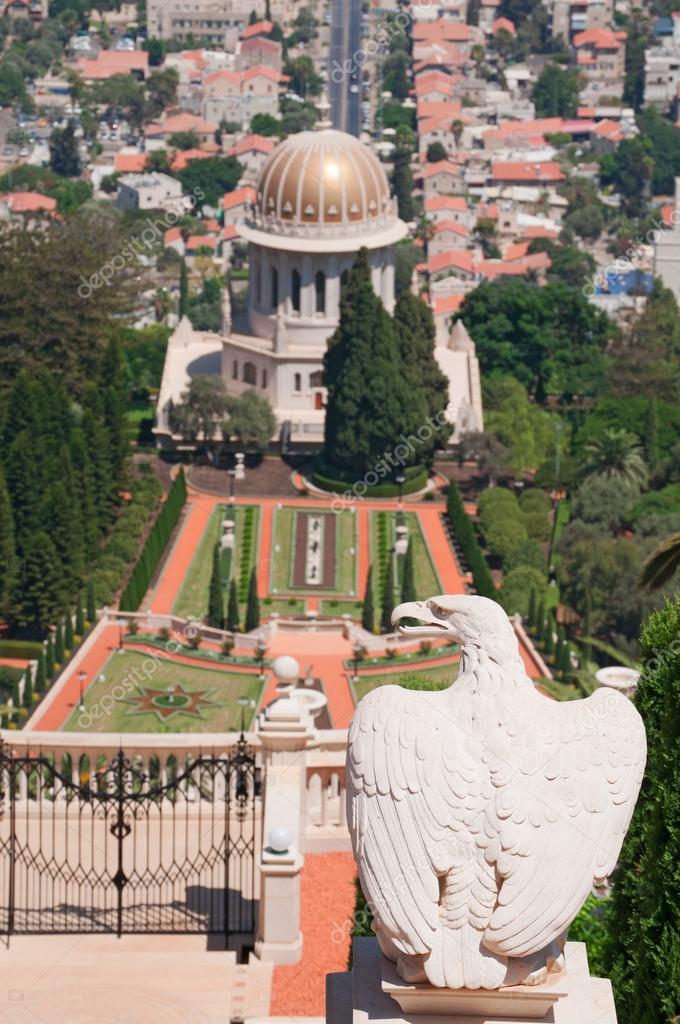 Haifa, Israel: a stone eagle statue and the Mausoleum of the Bab at ...