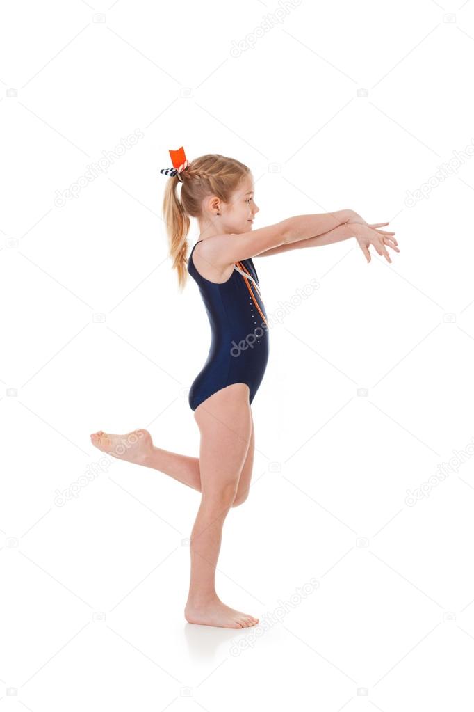 Gymnast: Young Girl Strikes A Pose Stock Photo by ©sjlocke 95429850