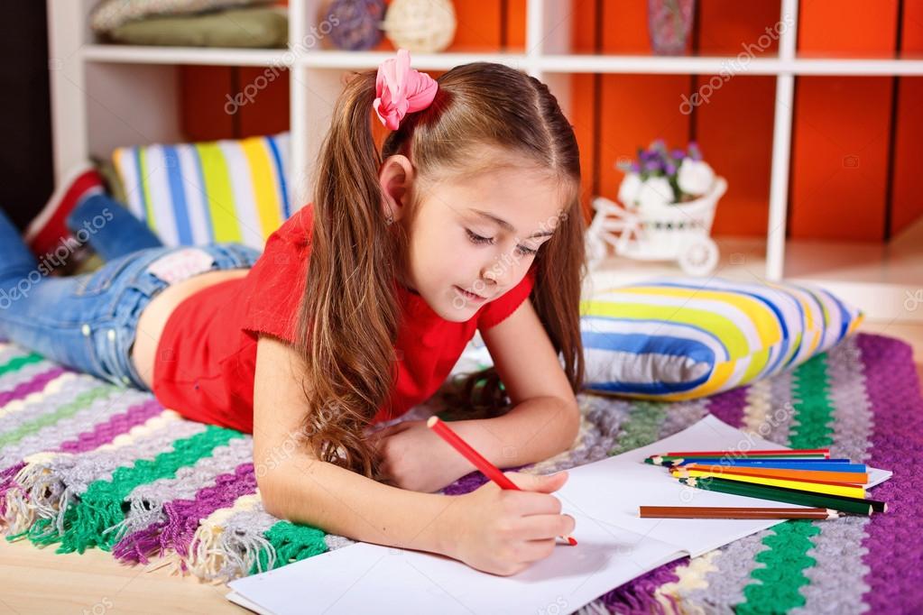 Girl drawing with pencils Stock Photo by ©HannaNes 57660939