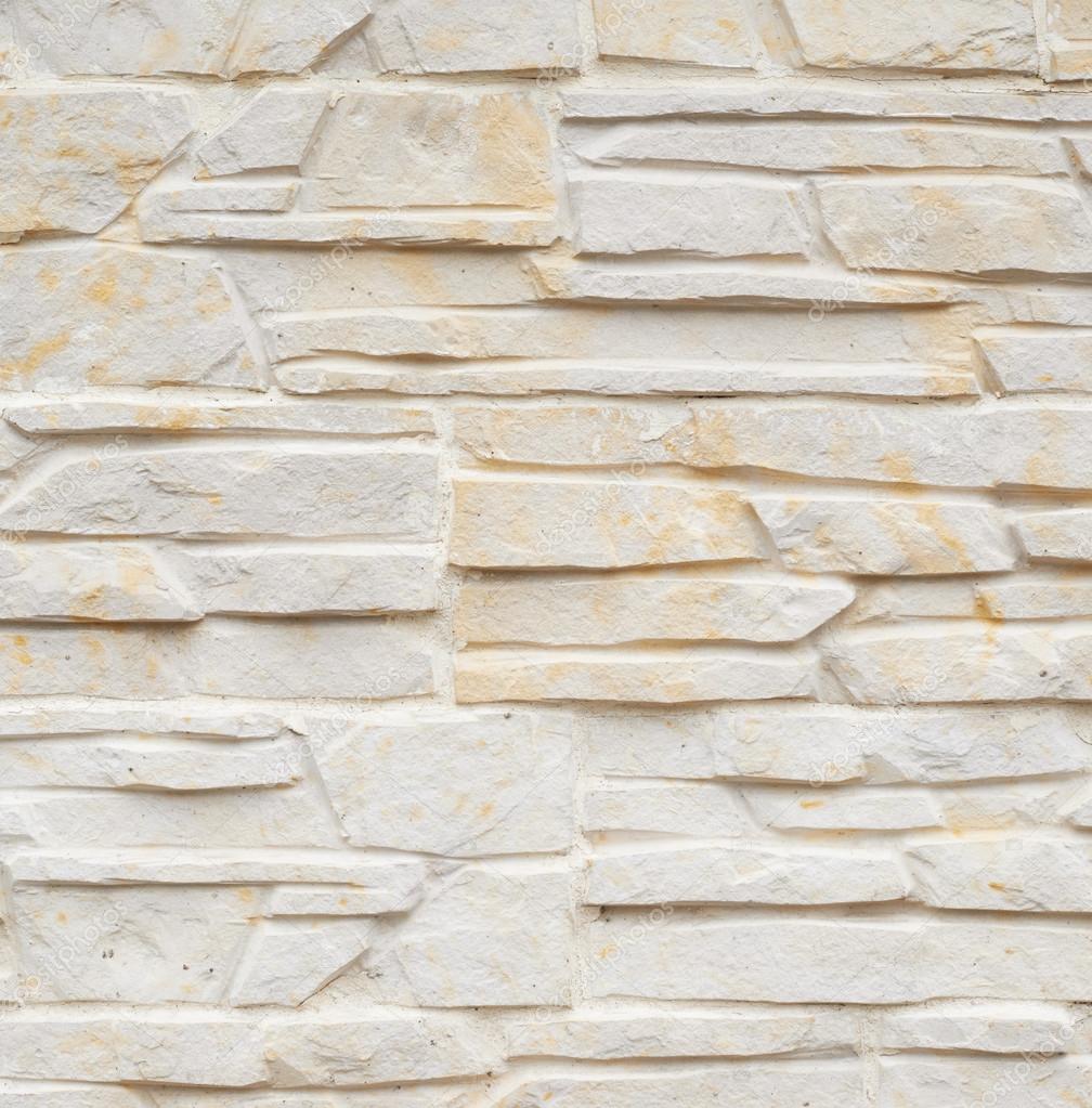 Wall of carved limestone bricks Stock Photo by ©exopixel 53482939