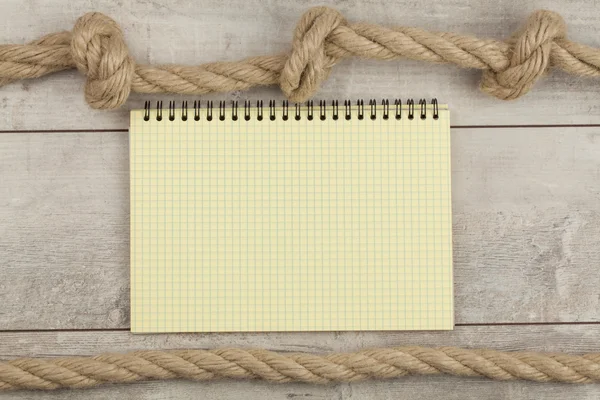 Wooden board with ship rope Stock Photo by ©axesor 68775513