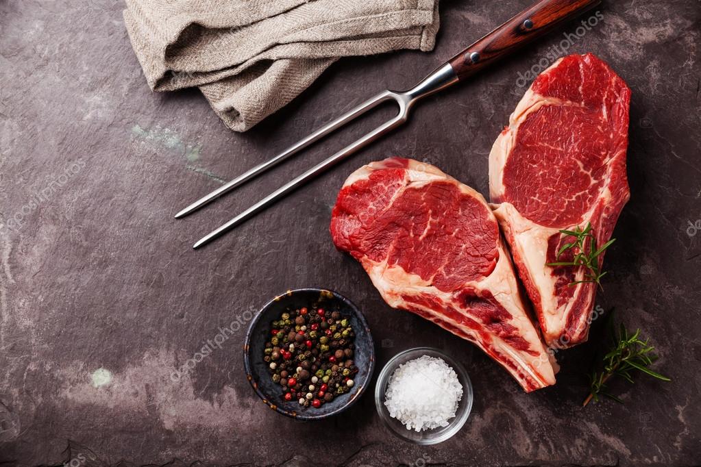 Heart shape Ribeye Steak with rosemary Stock Photo by ©lisovskaya 69372505