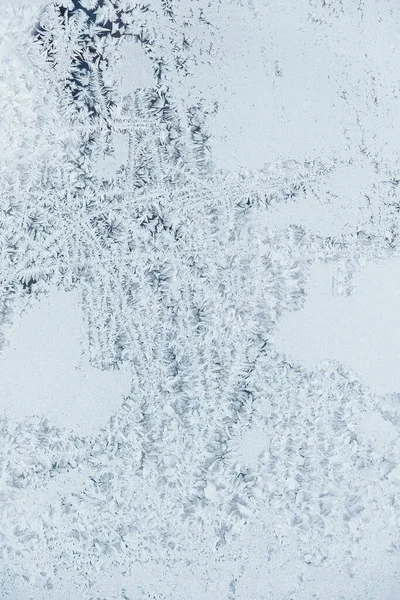 Ice patterns on frozen glass. Abstract ice pattern on winter glass as a ...