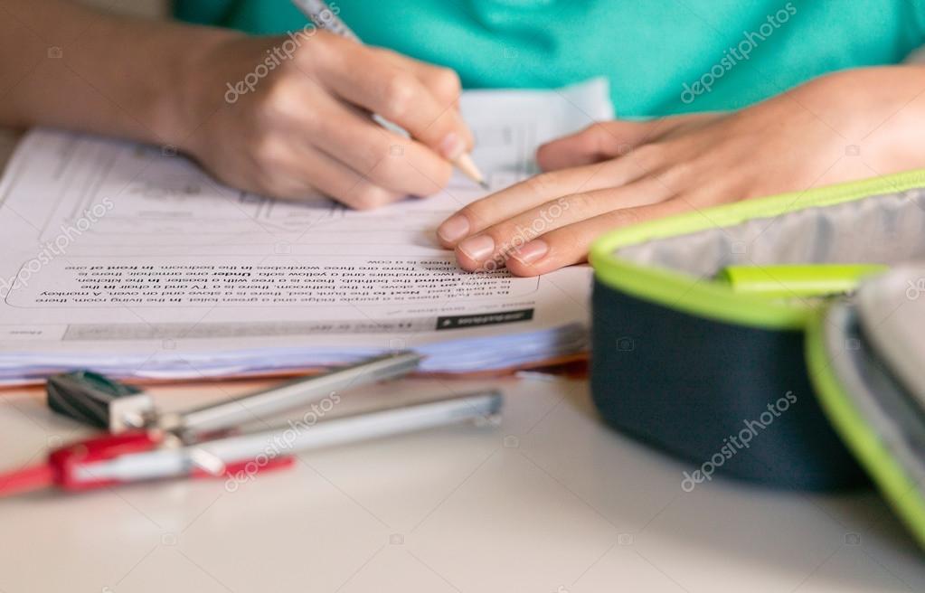 Child practicing English for an English work at school Stock Photo by ...