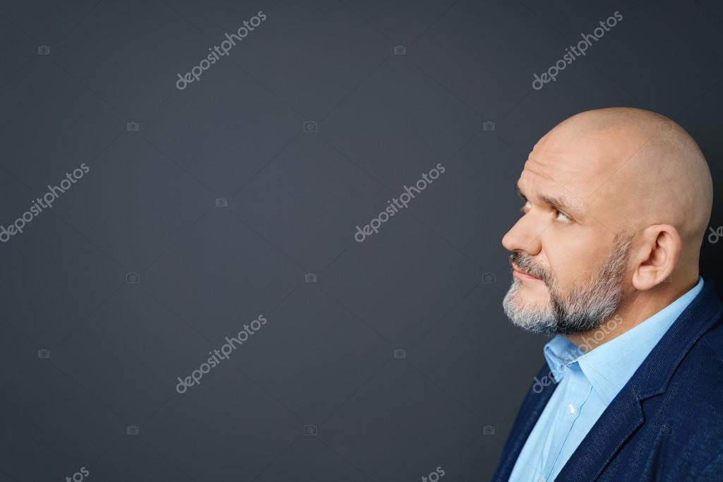 Thoughtful man staring at blank copyspace Stock Photo by ©racorn 100562058