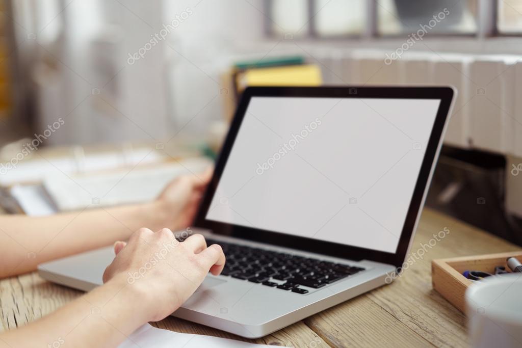 Hands typing on laptop with blank screen — Stock Photo © racorn #110281598