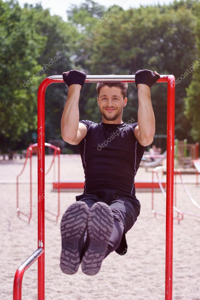 Man lifting his legs during fitness workout — Stock Photo © racorn ...