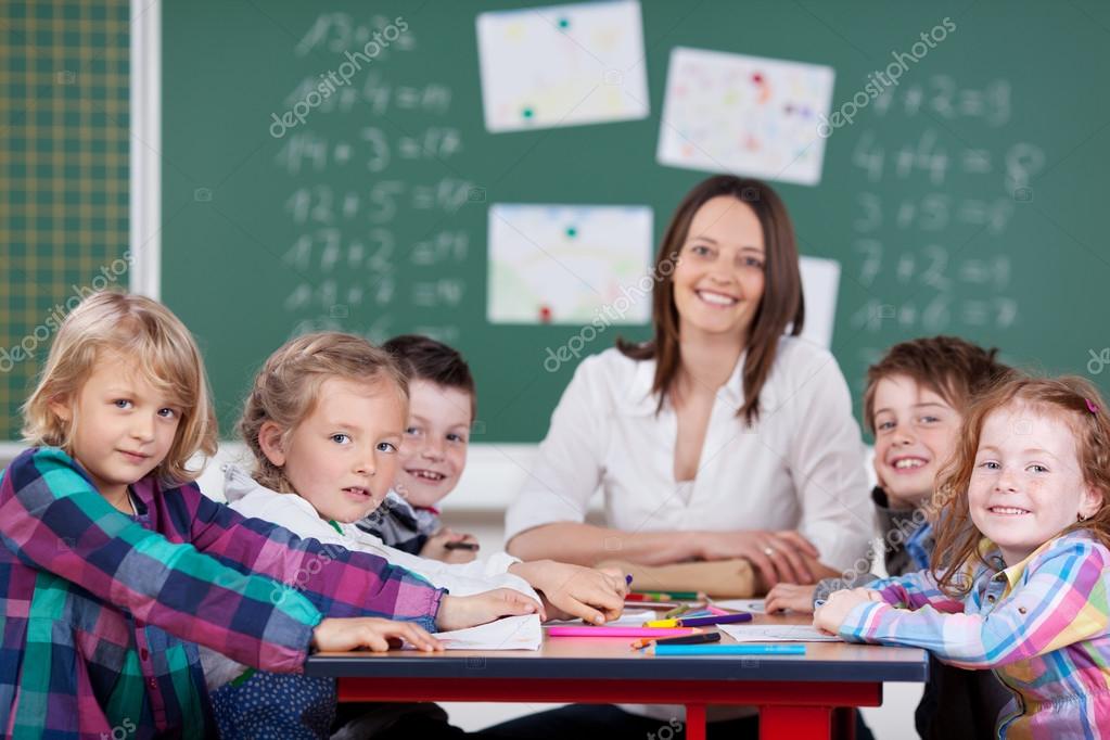 Female teacher leading class activity — Stock Photo © racorn #53242263