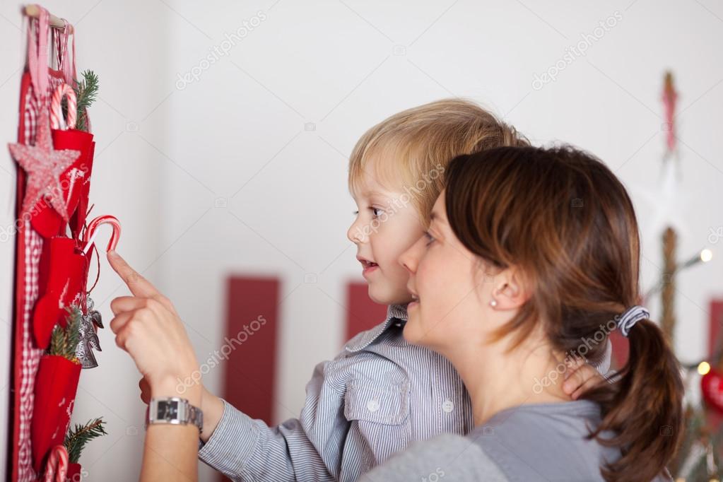 Mom Carrying a Baby Introducing Decors Names — Stock Photo © racorn ...