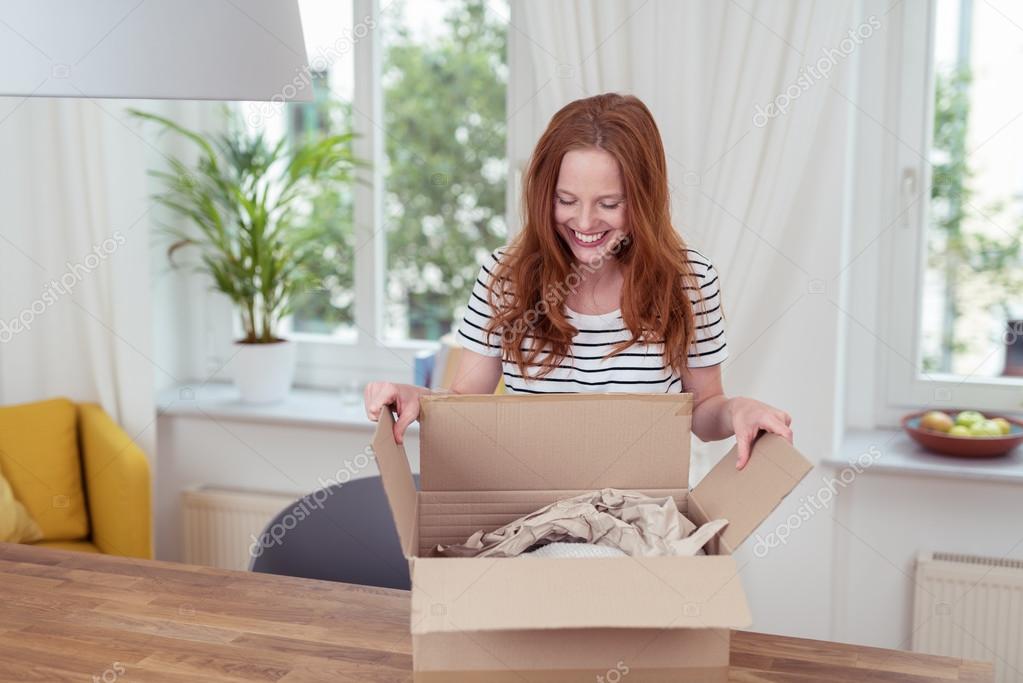 Happy Woman Opening her Present in a Carton box Stock Photo by ©racorn ...