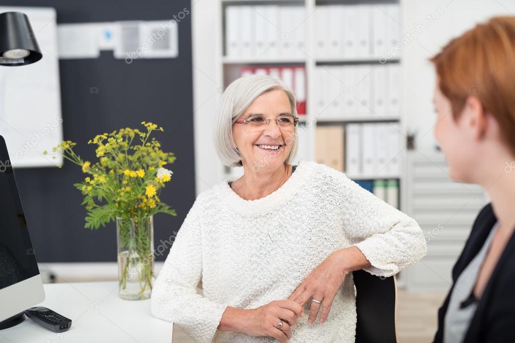 Middle Aged Office Woman Listens to Colleague — Stock Photo © racorn ...
