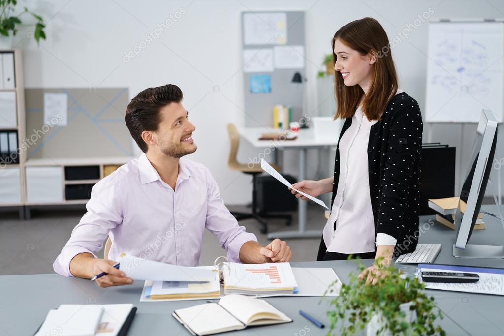Co-worker talking at the office Stock Photo by ©racorn 87967186