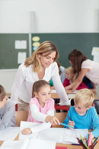 Two teachers working in a primary school - Stock Image - Everypixel