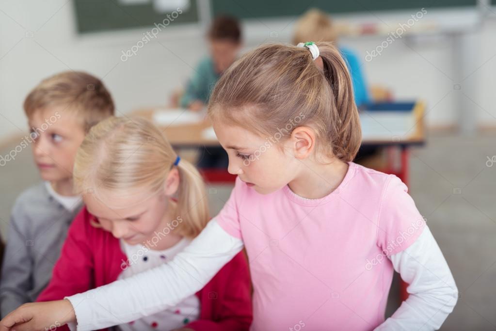 Three little children in class at school Stock Photo by ©racorn 91671194