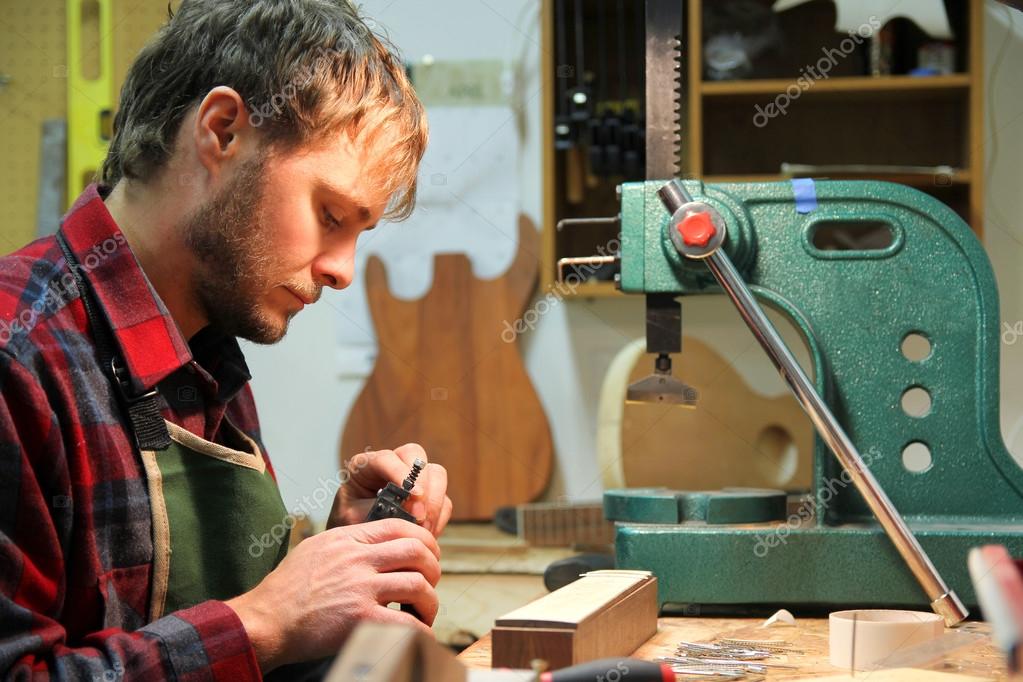 Luthier Woodworker Building Guitar in Workshop Stock Photo by ©Christin ...