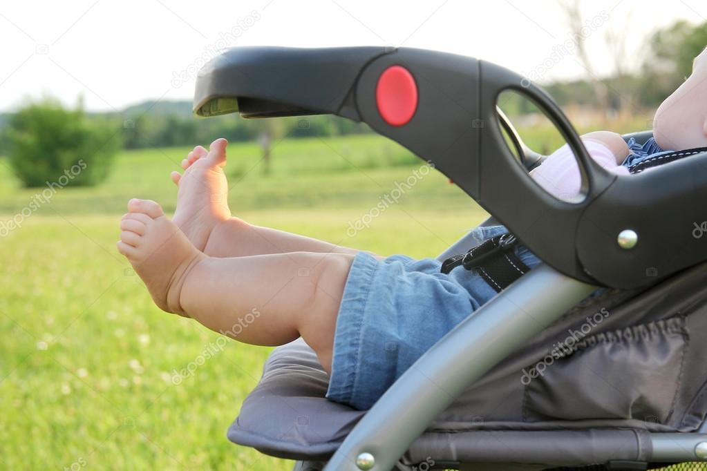 Newborn Infant legs and Feet Hanging out of Stroller ⬇ Stock Photo ...