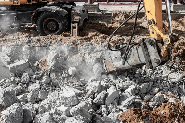 Construction work - dismantling. Professional demolition of reinforced ...