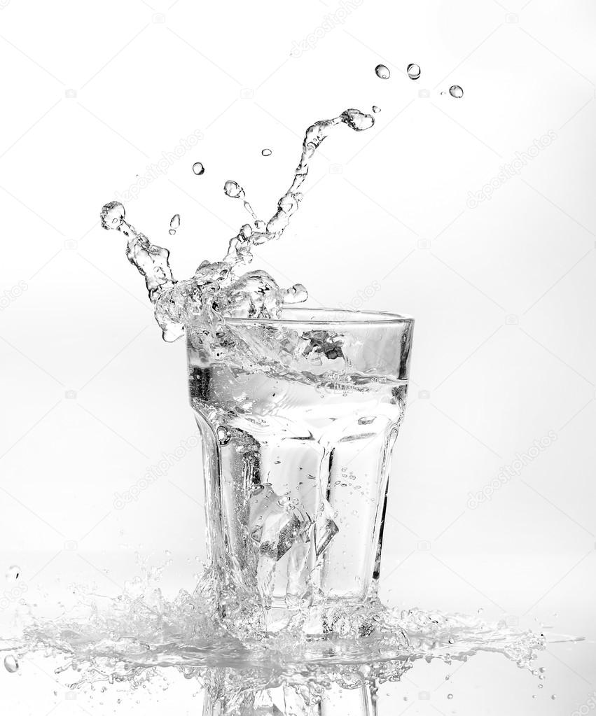 Ice cubes splashing into glass of water Stock Photo by ©9parusnikov ...
