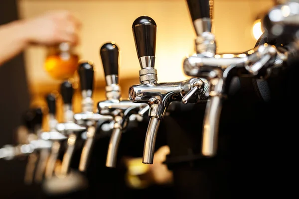 Beer taps in a pub Stock Photo by ©vova130555@gmail.com 185191042