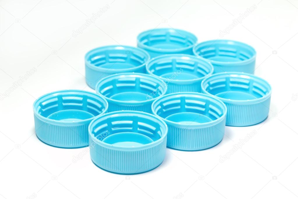 Light blue plastic bottle caps Stock Photo by ©maicyber 96786636