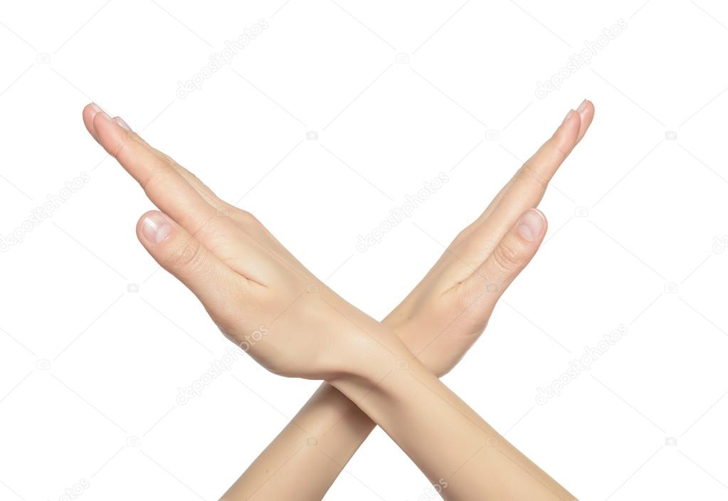 Female crossing hands forming an x — Stock Photo © believeinme #63302411