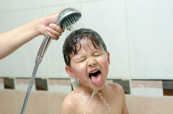 Boy washing hair with shampoo Stock Photo by ©sasha1806 121537378
