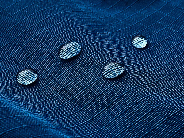 Water drops on waterproof membrane fabric. Detail view of texture of ...