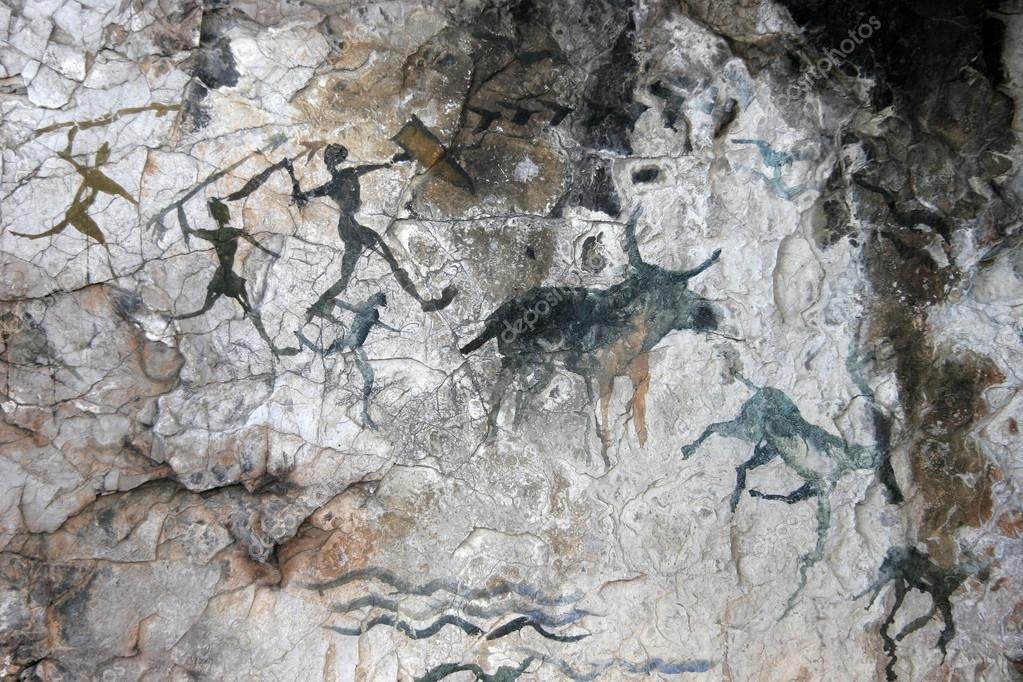 Cave paintings of primitive man — Stock Photo © zatvornik71 #83697182