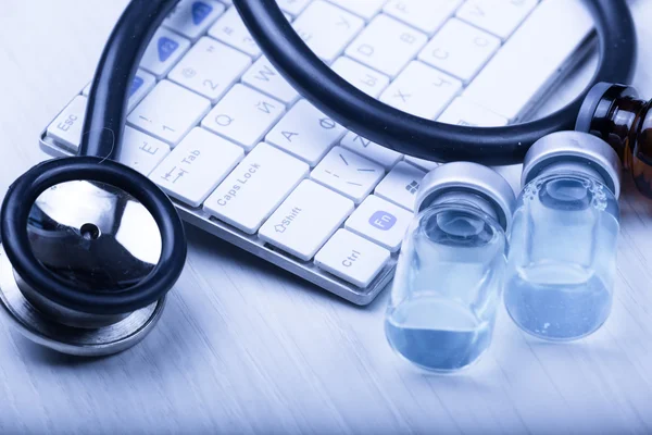 Medical devices on the table at the doctor with blue toned - Stock ...