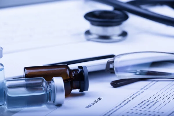 medical devices on the table at the doctor with blue toned - Stock ...