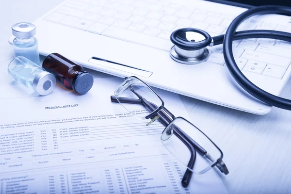 Medical devices on the table at the doctor with blue toned - Stock ...