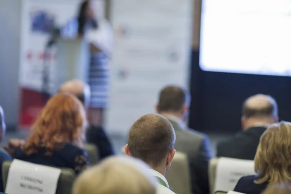 Host Speaker Standing on Stage in Front of the Audience at the ...