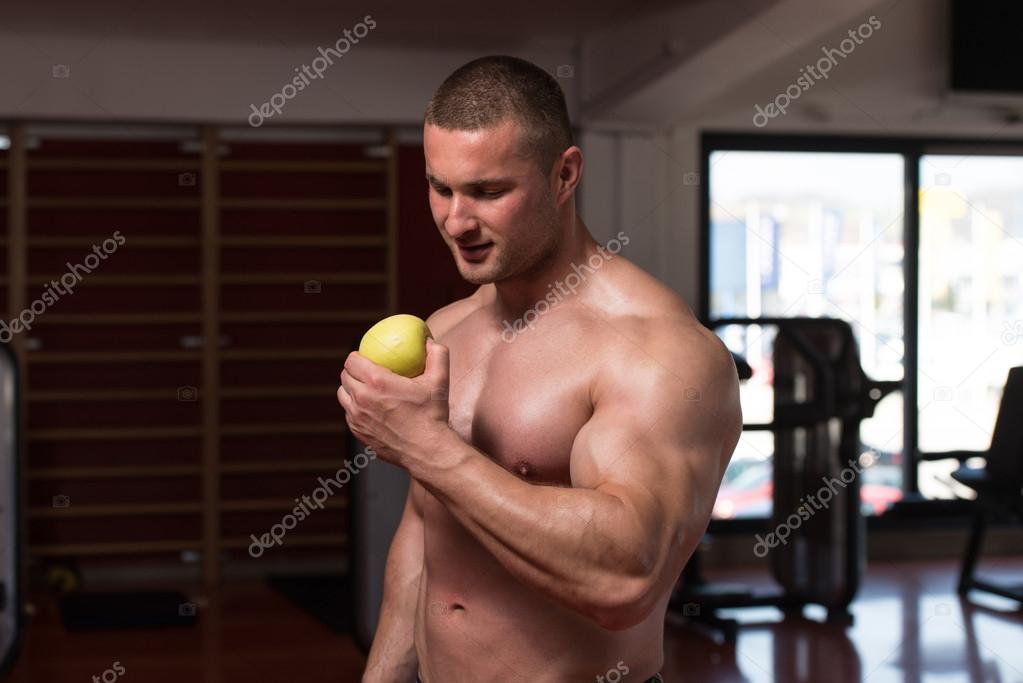 Bodybuilder Man Eating An Apple Stock Photo by ©ibrak 102929032