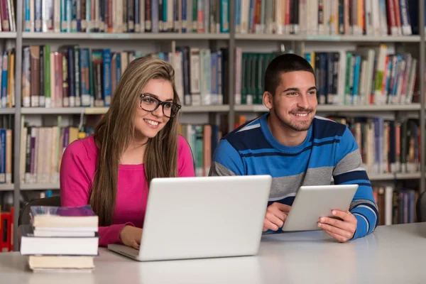 Couple Of Students With Laptop In Library - Stock Image - Everypixel