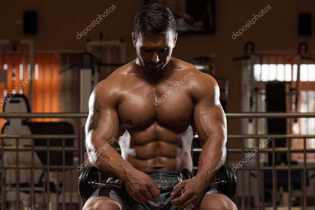Healthy Young Man Resting In Health Club — Stock Photo © ibrak #63714381
