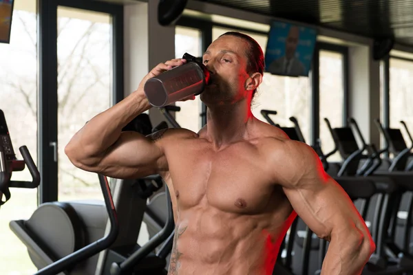 Bodybuilder Drinking Water From Shaker - Stock Image - Everypixel