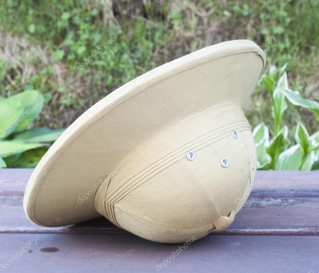 Pith helmet located on the painted bench. Stock Photo by ©indigolotos ...