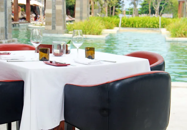 Poolside dining table — Stock Photo © apolobay #104206158