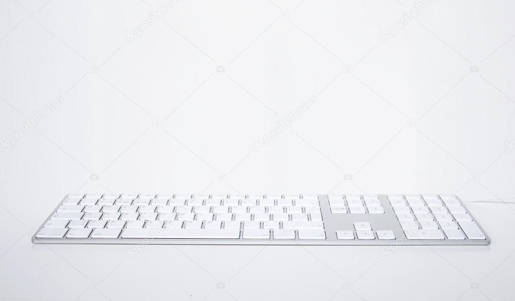 White modern keyboard on a gray background Stock Photo by ©apolobay ...