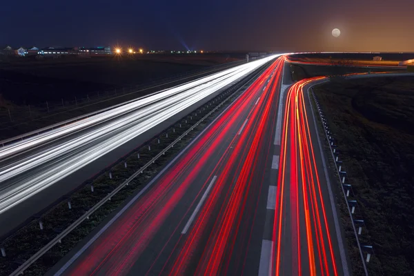 Speed Traffic - light trails on motorway highway at night — Stock Photo ...