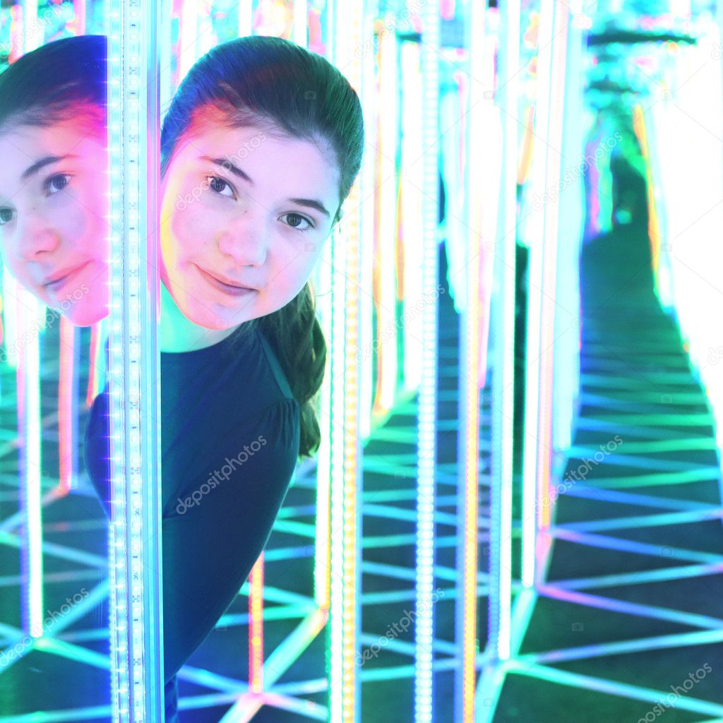 Girl in mirror maze try to find way out — Stock Photo © Ulianna #92371450