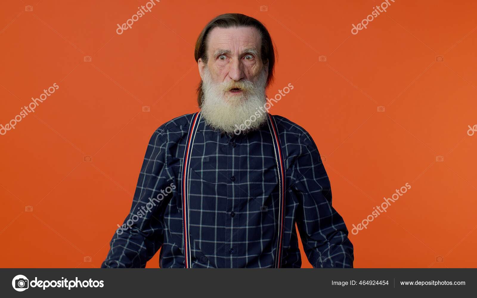 Stressed depressed mature old man expresses his fear and waves his ...