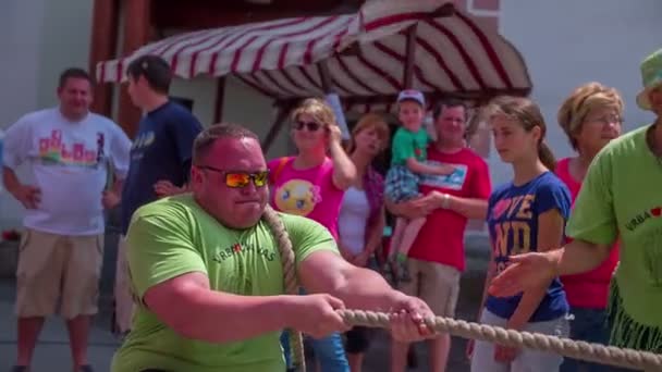 Strong man is pulling a rope on the tug competition — Stock Video ...