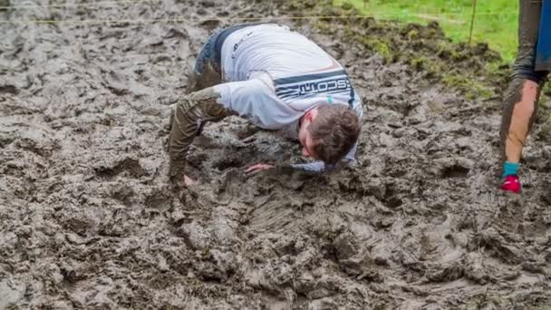 Woman crawling through mud — Stock Video © probakster #97485154