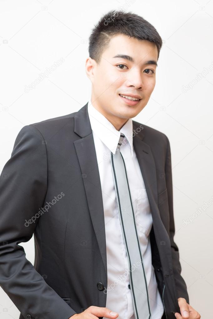 Asian handsome smart young business man on black suit smilling — Stock ...