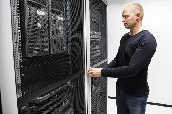 Computer Engineer Opening Server Rack Door In Data Center - Stock Image ...