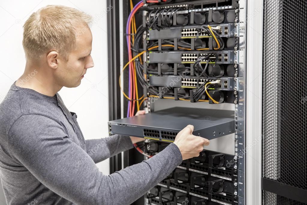IT consultant build network racks in datacenter — Stock Photo © kjekol ...