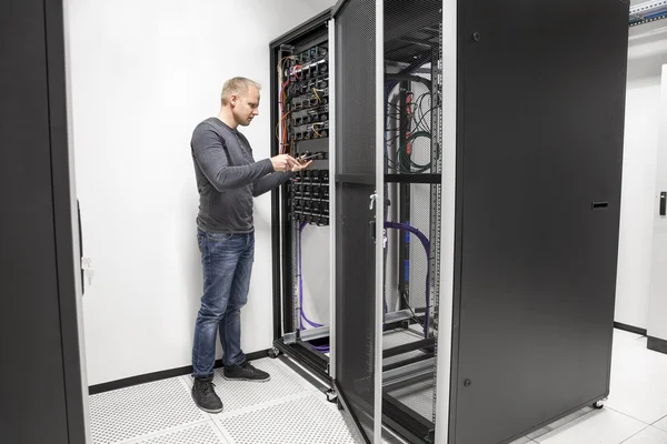 IT consultant build network racks in datacenter — Stock Photo © kjekol ...